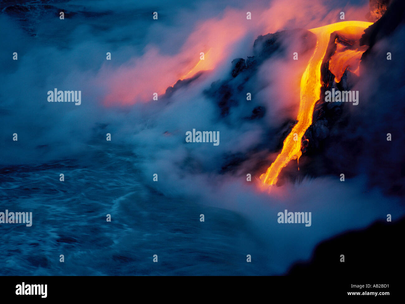 Glowing streams of lava flowing into the ocean off Hawaii and causing ...