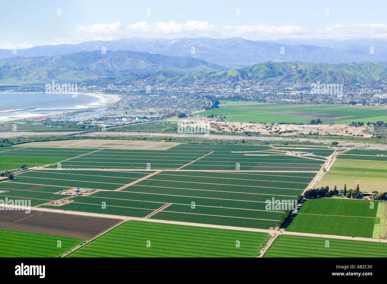 Aerial view of Oxnard farm fields in spring with Ventura City and ...