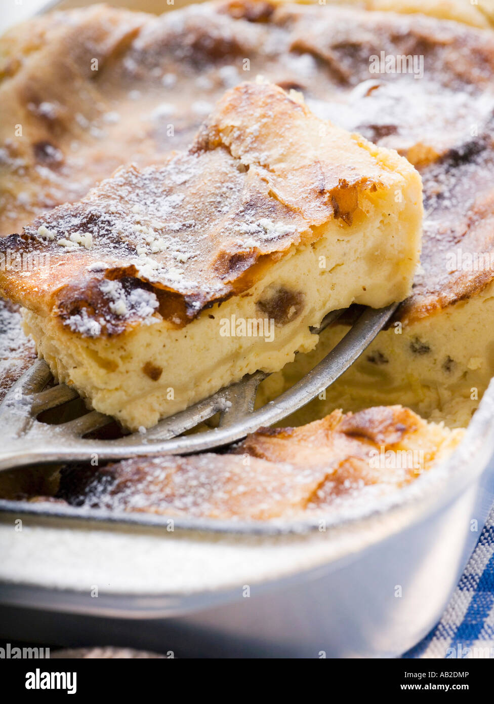 Curd cheese strudel in baking tin with piece on server FoodCollection ...