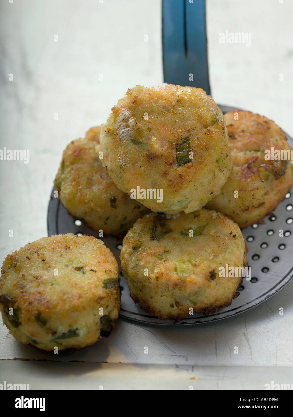 Fish cakes on skimmer FoodCollection Stock Photo - Alamy