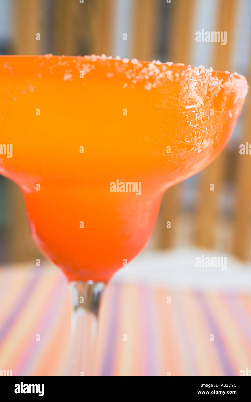 Margarita in orange glass with salted rim FoodCollection Stock Photo ...