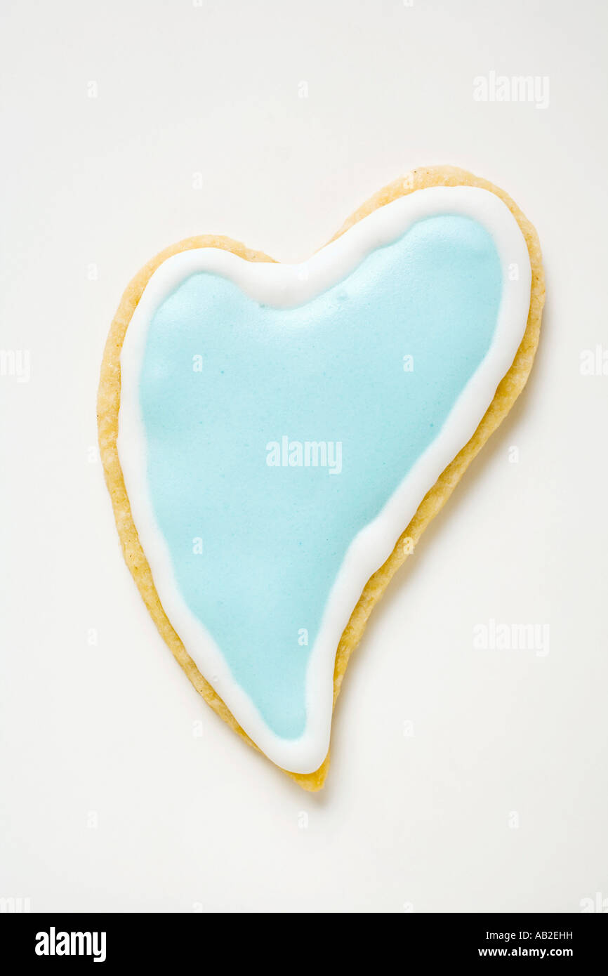 Heart shaped biscuit with pale blue icing FoodCollection Stock Photo ...