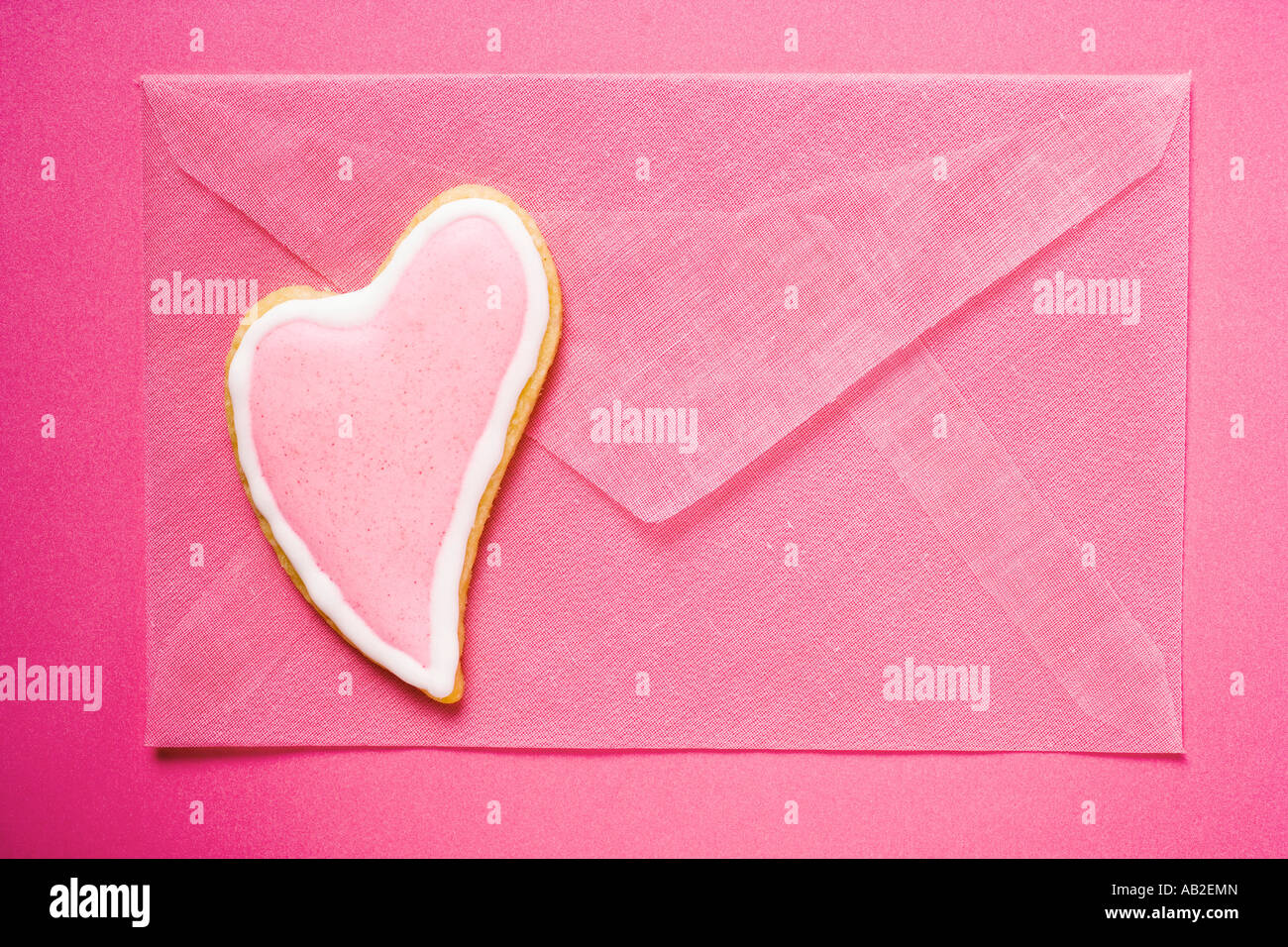 Pink envelope with heart shaped biscuit FoodCollection Stock Photo - Alamy