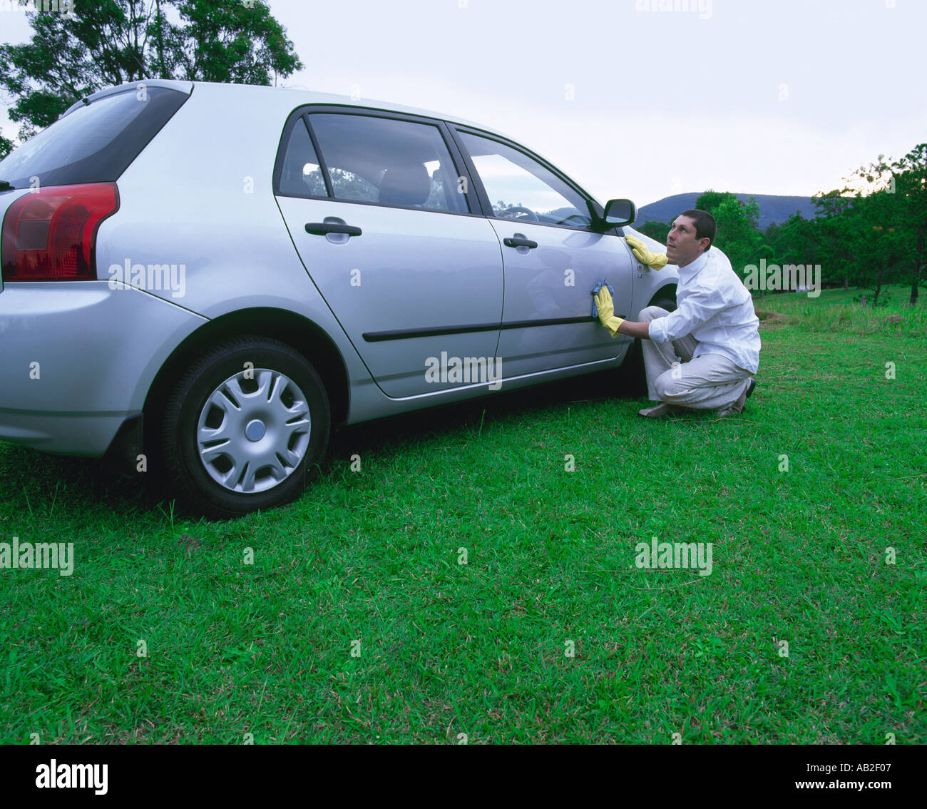 Man washing a car outdoors Stock Photo - Alamy