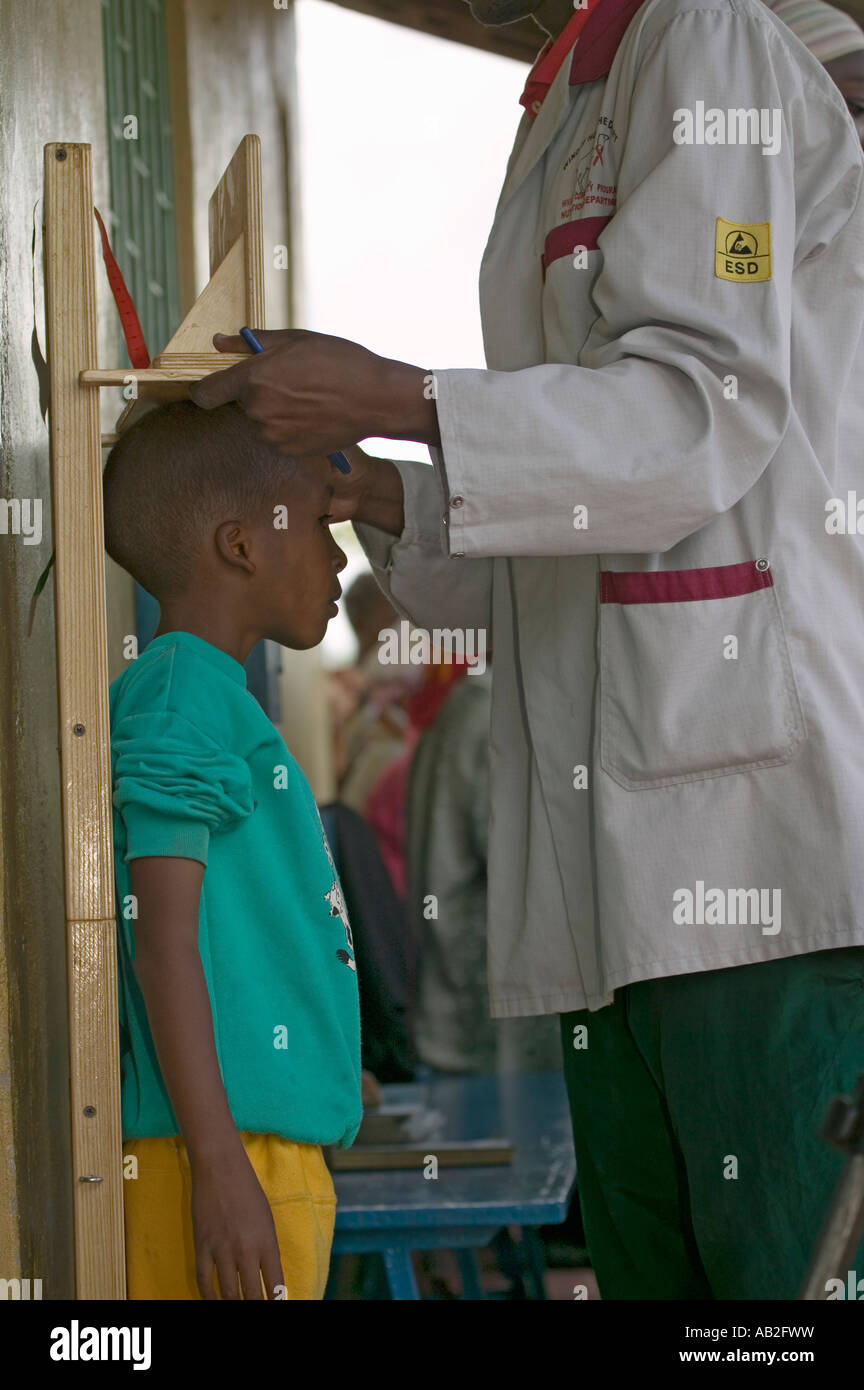 Young boy with HIV AIDS is measured at the Pepo La Tumaini Jangwani HIV ...