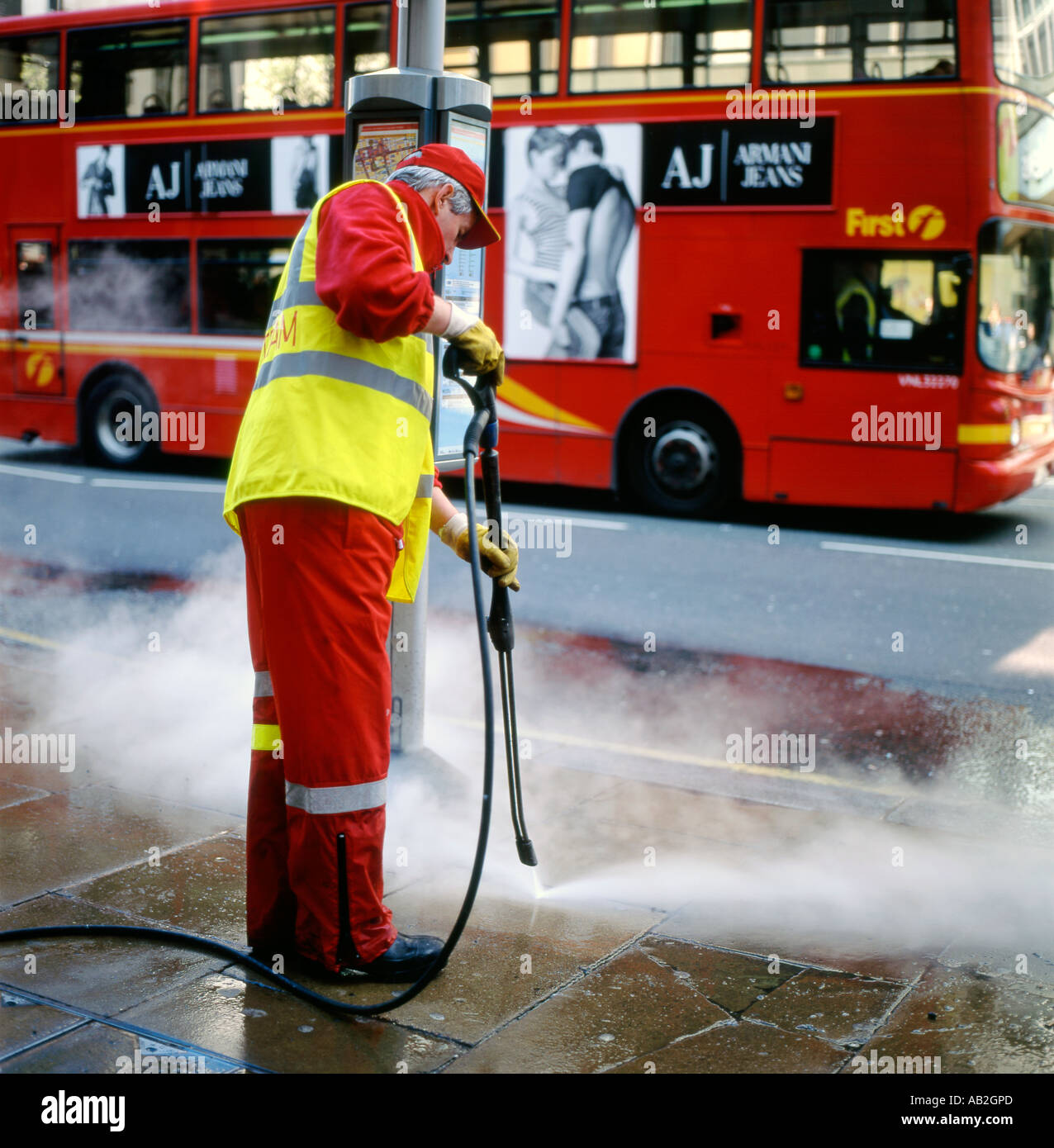 Workman cleaning gum from Oxford Street pavement with a high pressure ...