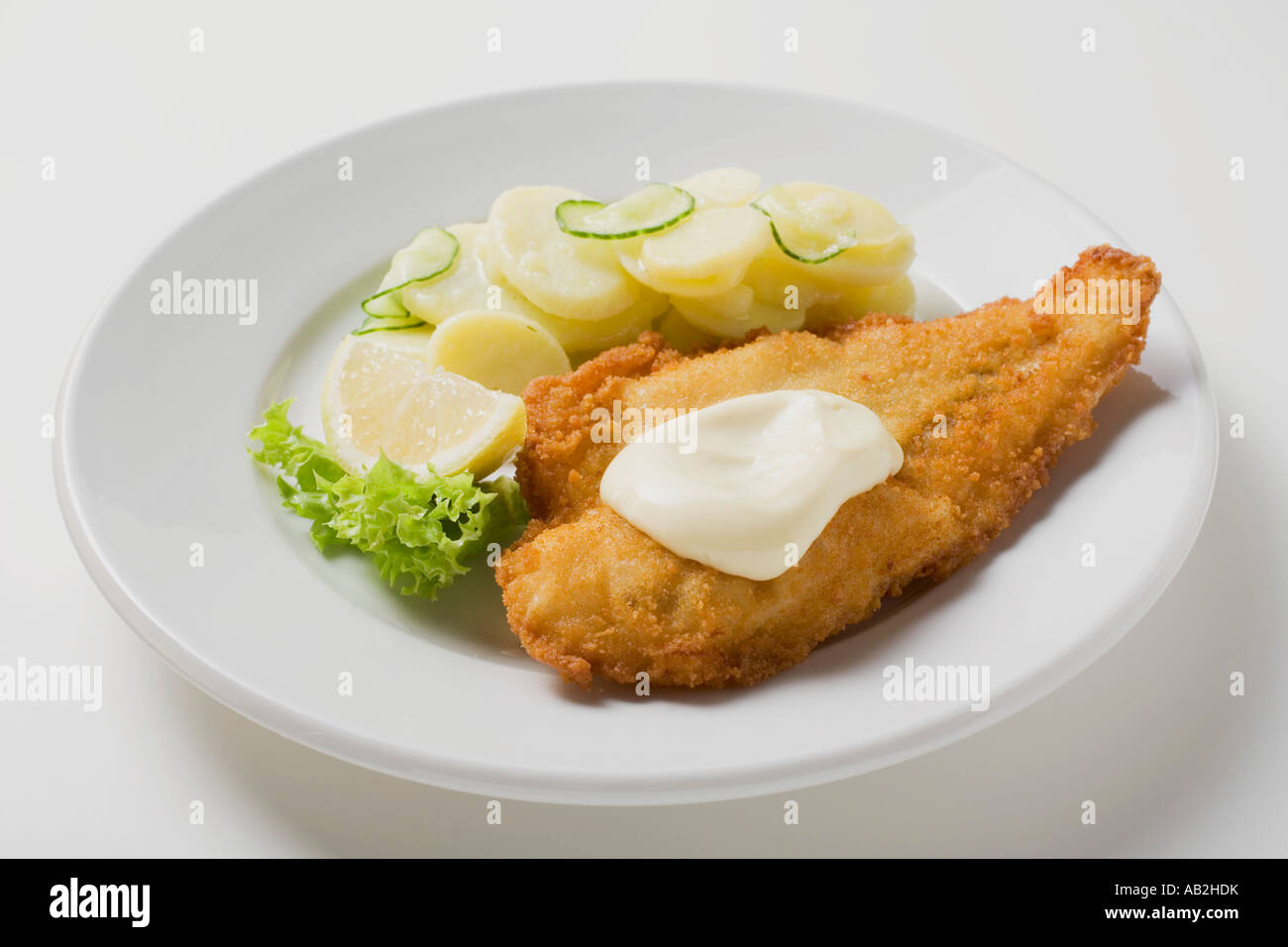 Fish fillet with mayonnaise and potato salad FoodCollection Stock Photo ...