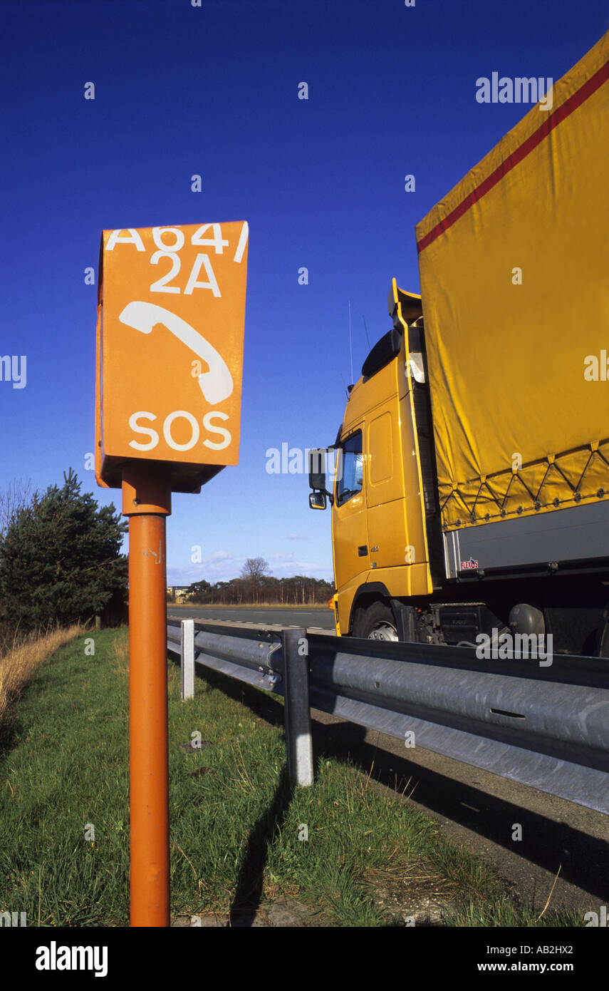 lorry stopped by emergency sos telephone in layby by the roadside uk ...
