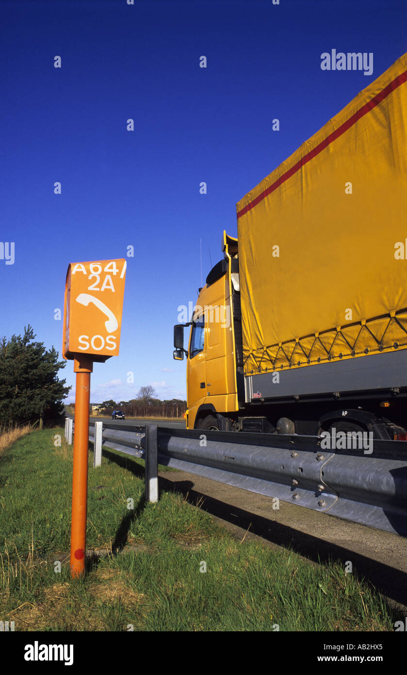 lorry stopped by emergency sos telephone in layby by the roadside uk ...