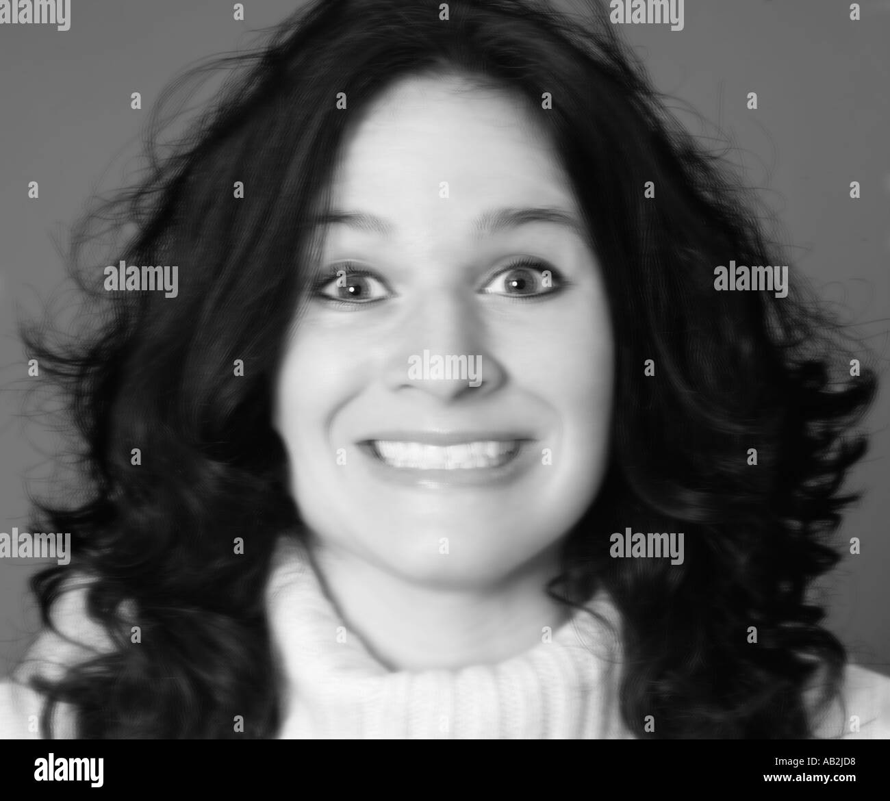 Young woman grinning Stock Photo - Alamy