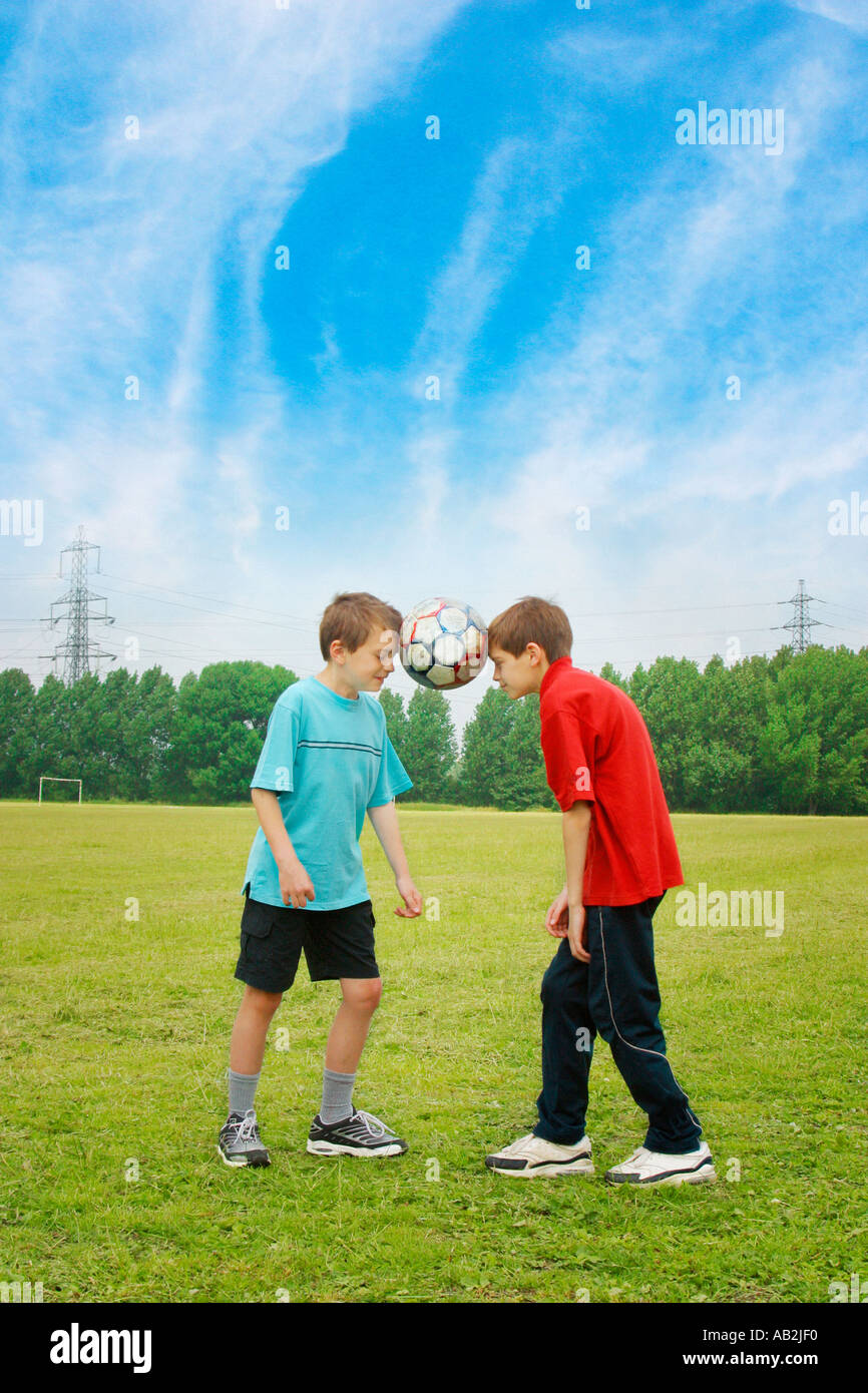 Boys football heading ball hi-res stock photography and images - Alamy