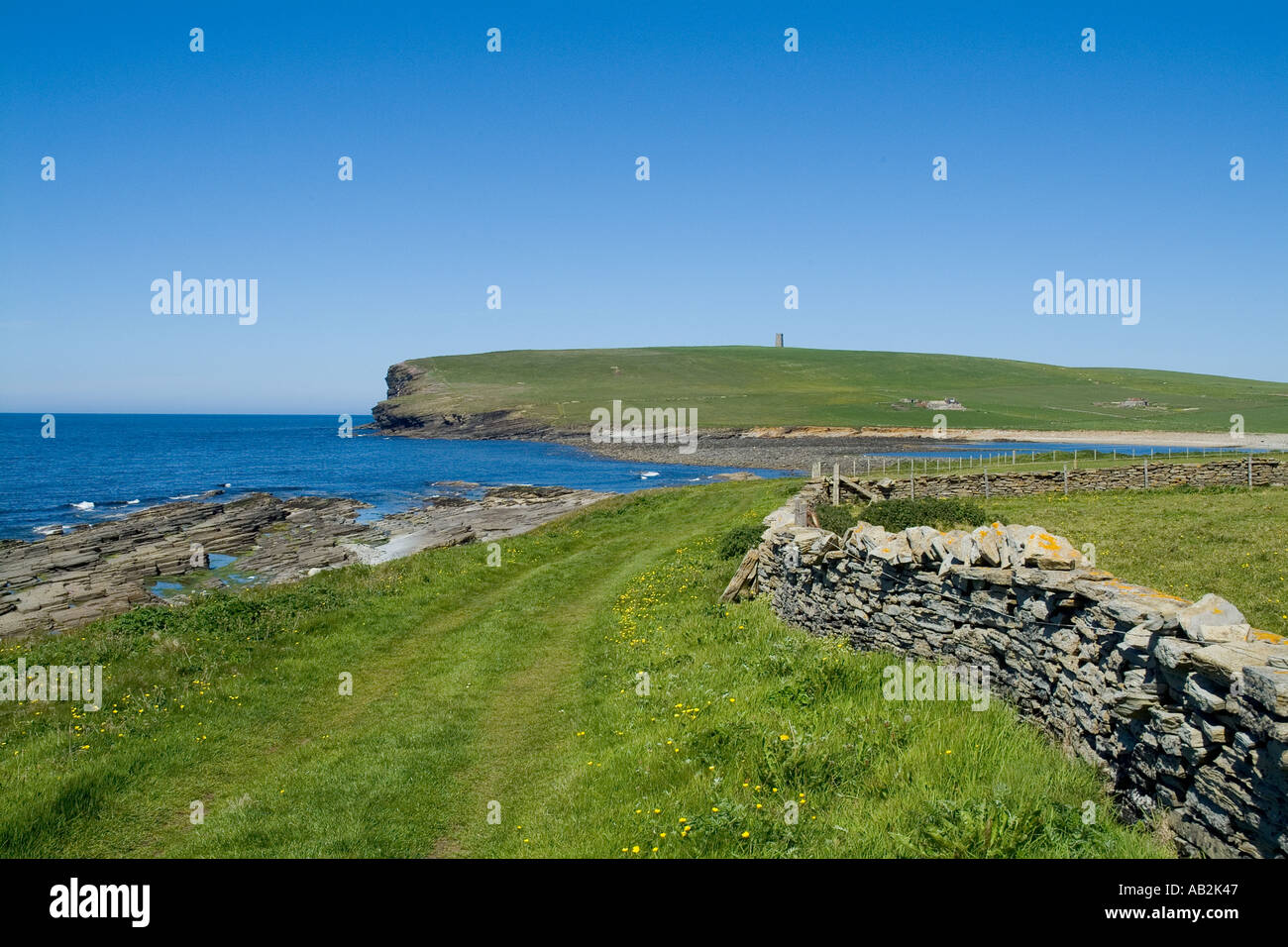 dh Marwick bay BIRSAY ORKNEY Coastal path stone wall Kitchener Memorial ...