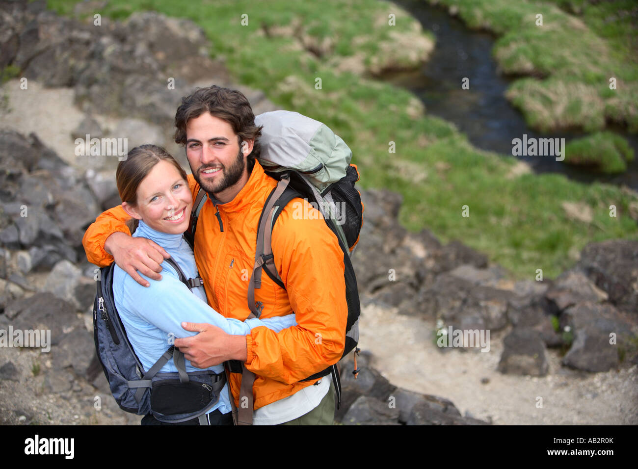 Backpacking couple pose for a portrait Stock Photo - Alamy
