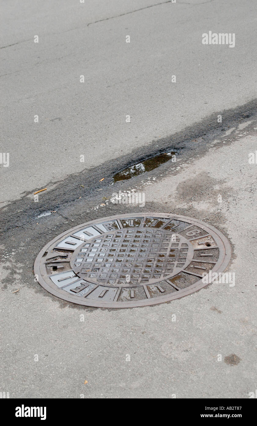 Manhole in street hi-res stock photography and images - Alamy