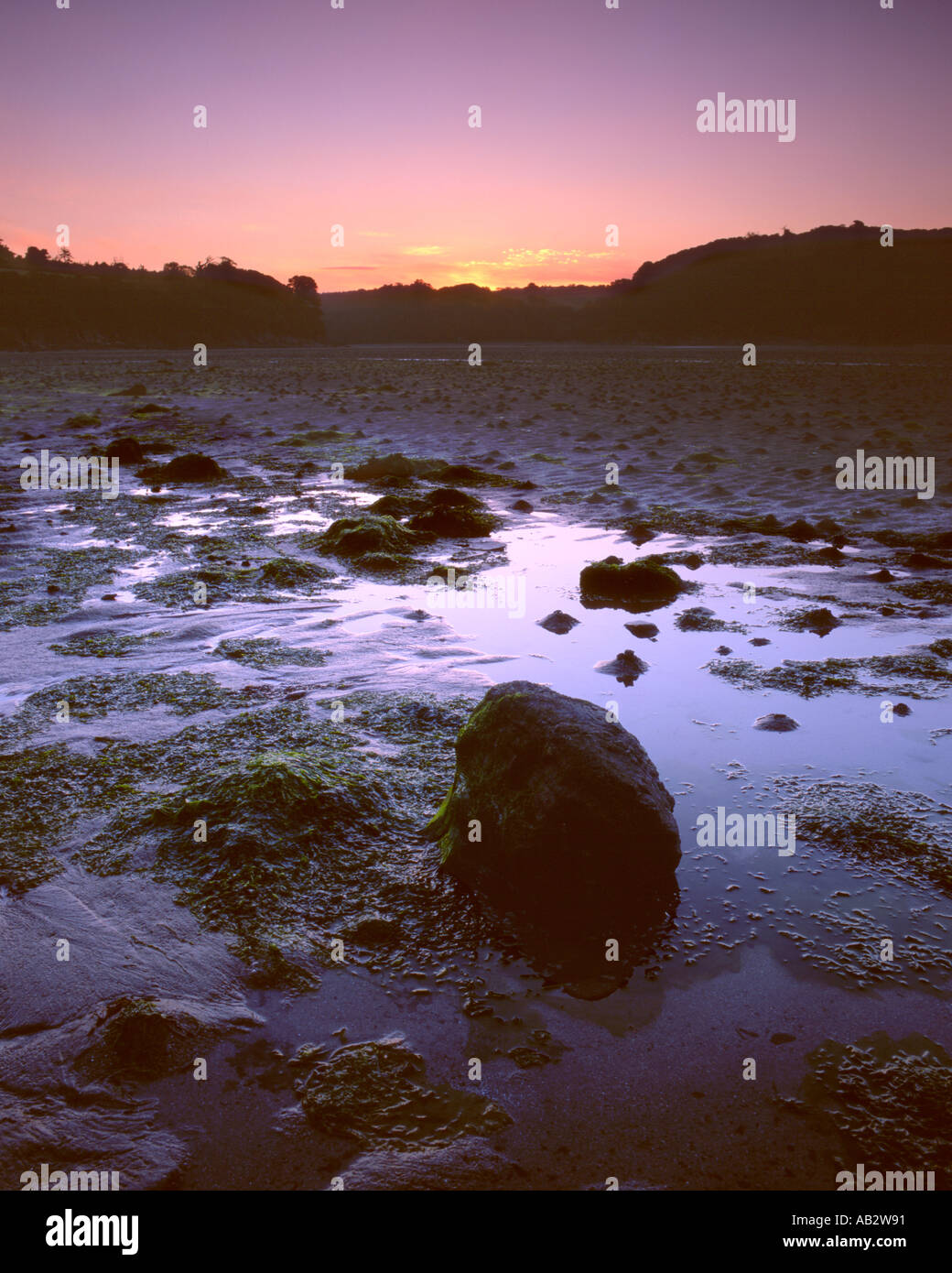 Mothecombe Beach South Devon at sunrise over Erme estuary with orange ...