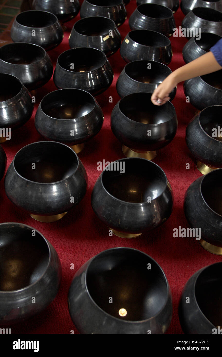 Hand dropping coins hi-res stock photography and images - Alamy