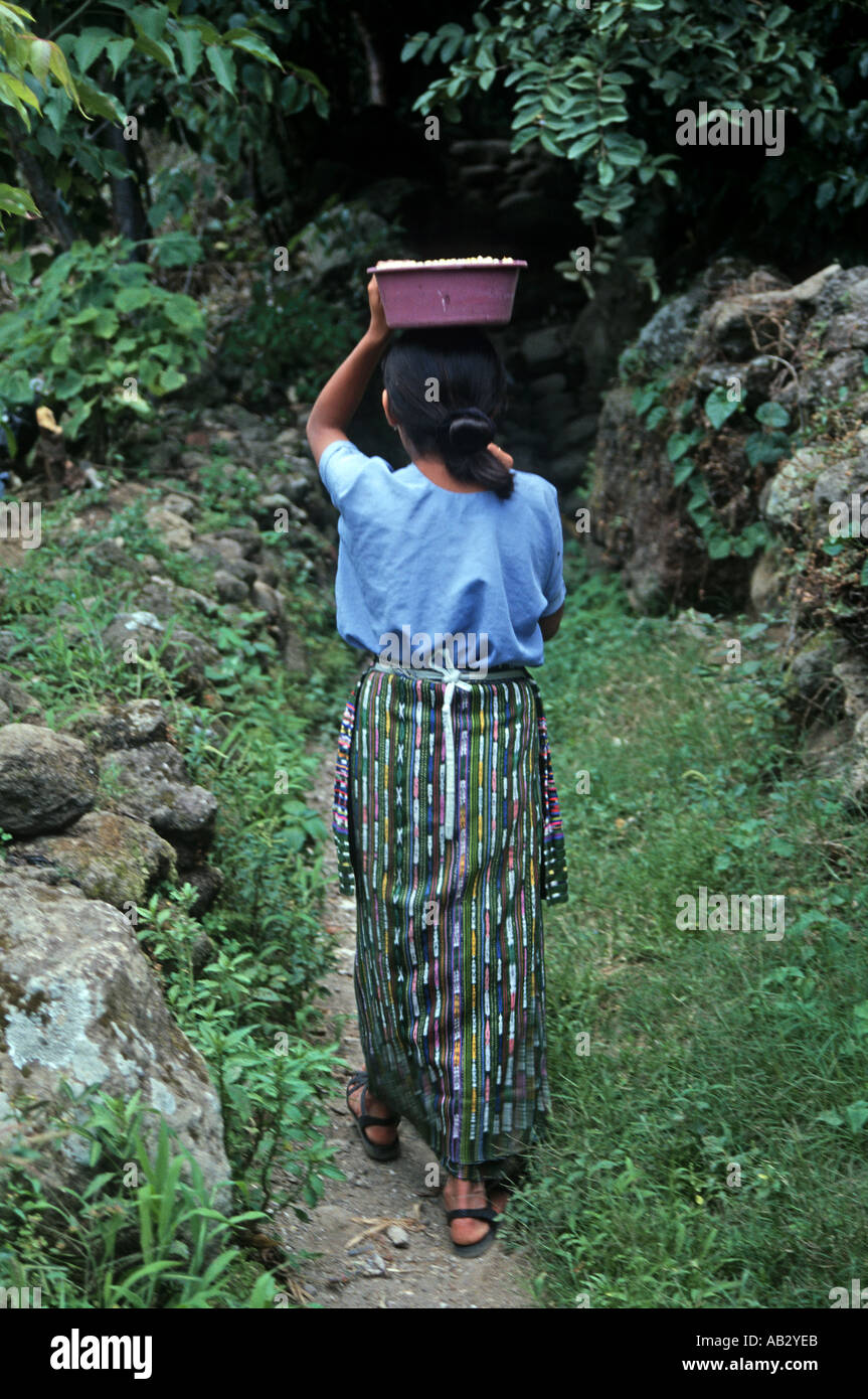 A young indigenous girl walks into the jungle near San Pedro La Laguna ...