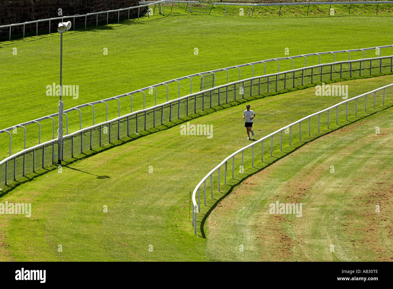 Jogging around the Chester Roodee racecourse Stock Photo - Alamy