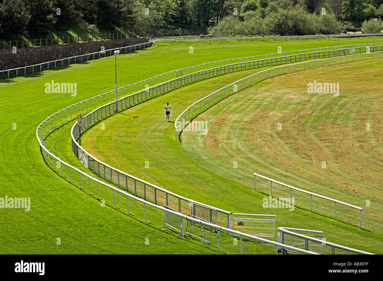 Jogging around the Chester Roodee racecourse Stock Photo - Alamy
