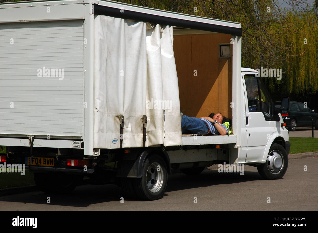 White van man asleep in the back of his vehicle during a break Stock ...