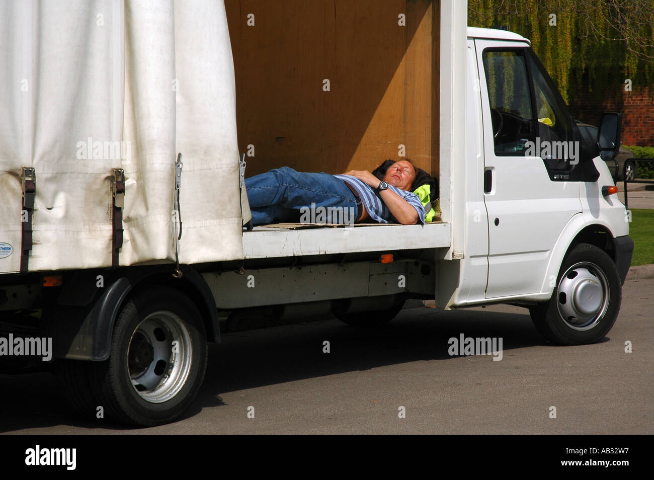 White van man asleep in the back of his vehicle during a break Stock ...