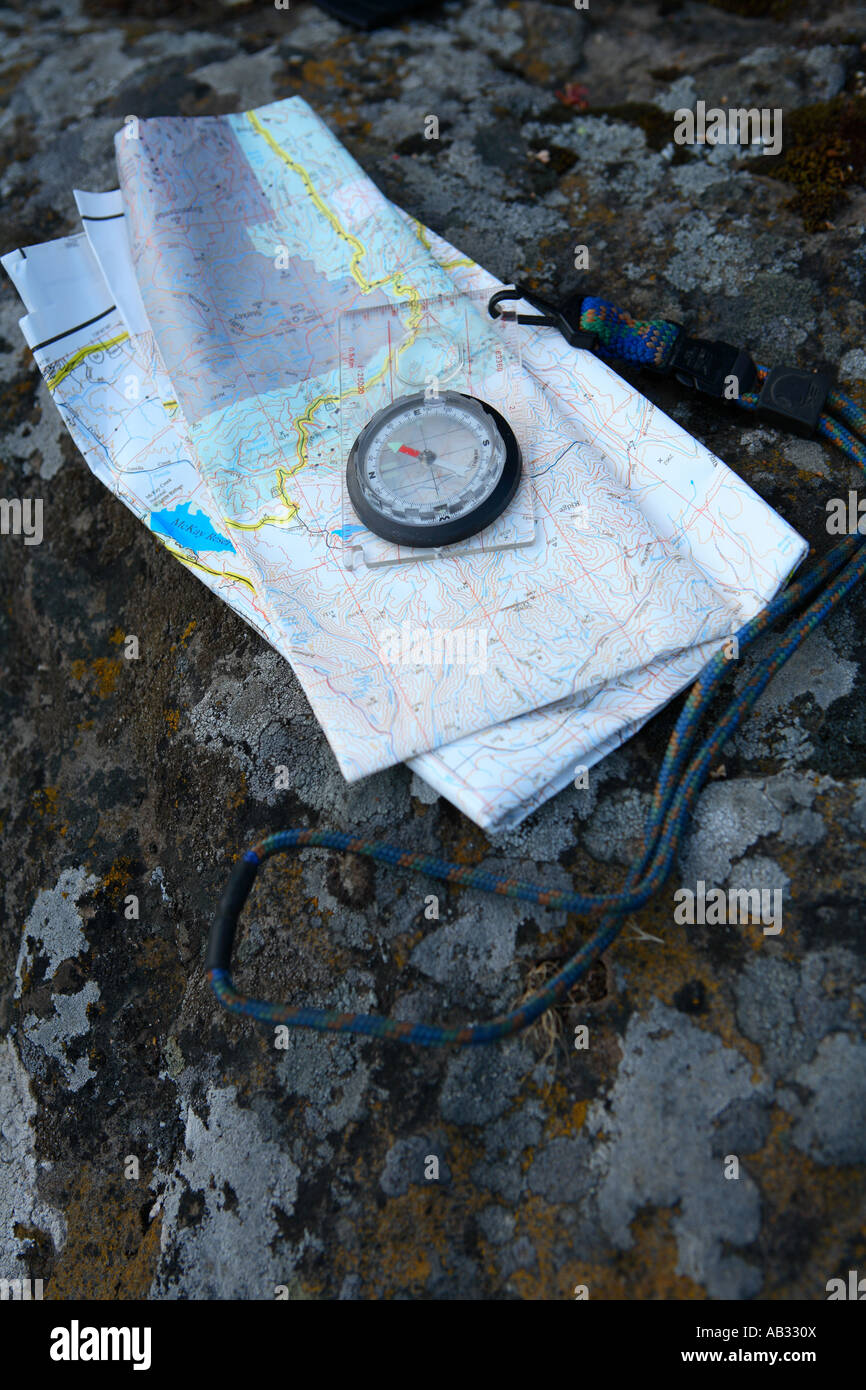 Map and compass on rocks Stock Photo - Alamy