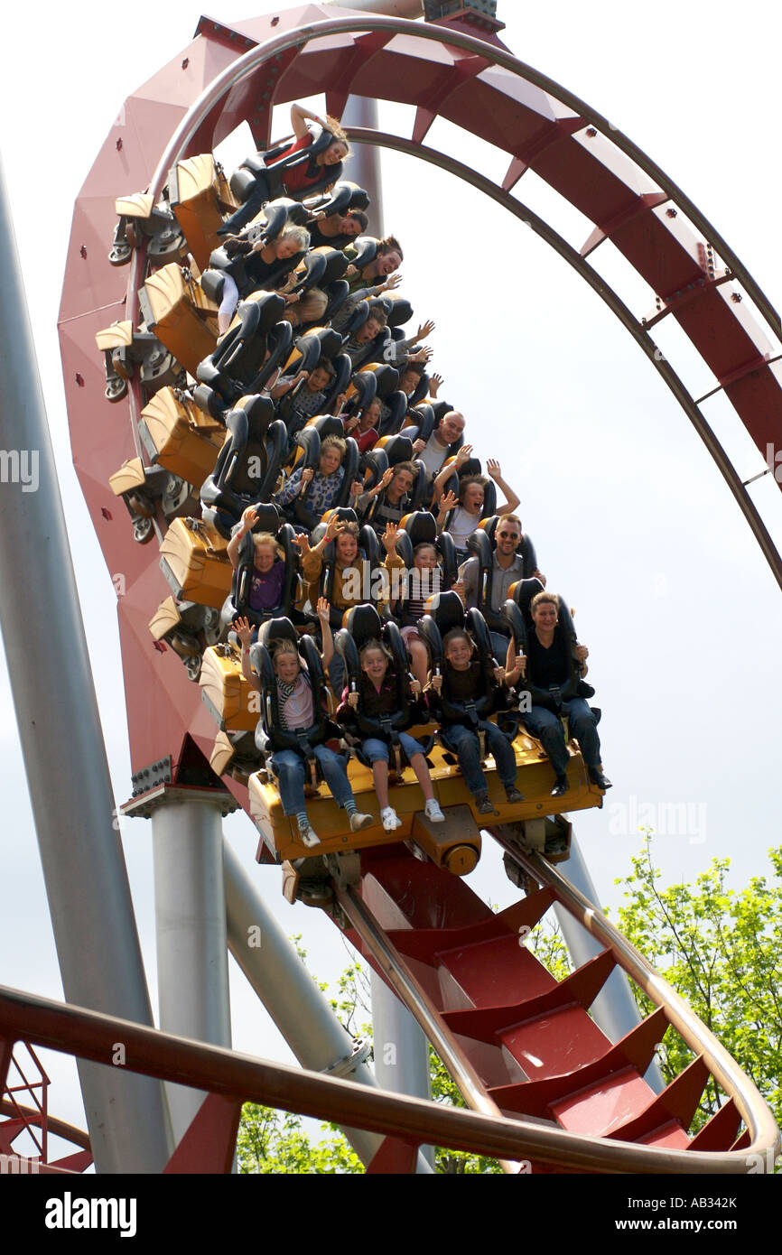 People riding a roller coaster at the Tivoli Gardens amusement park in ...