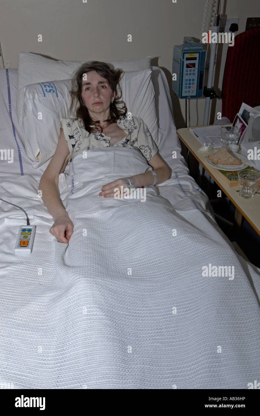Female patient in cancer ward with a worried expression on her face in ...
