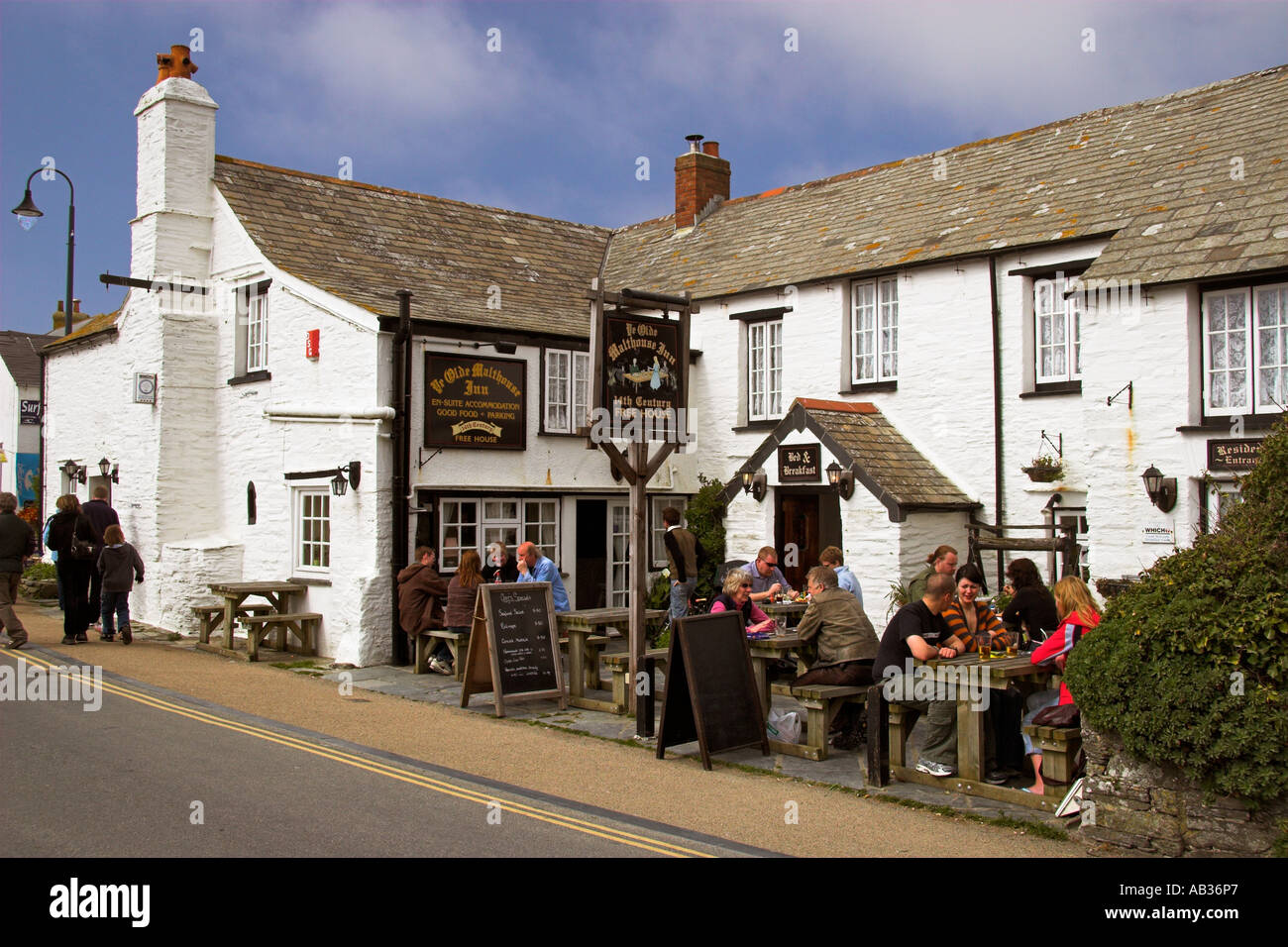 People drinking beer in the beer garden of Ye Olde Malthouse Inn a 14th ...