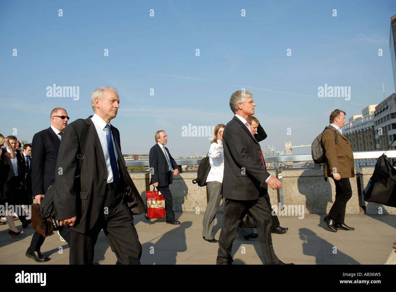 Commuters on London Bridge in the evening rush hour City of London ...