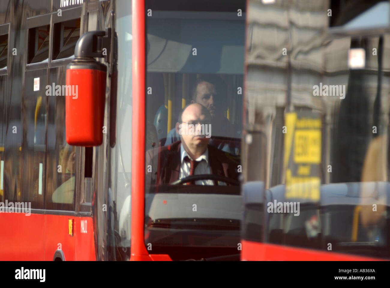 Commuter bus driver on London Bridge in the evening rush hour City of ...