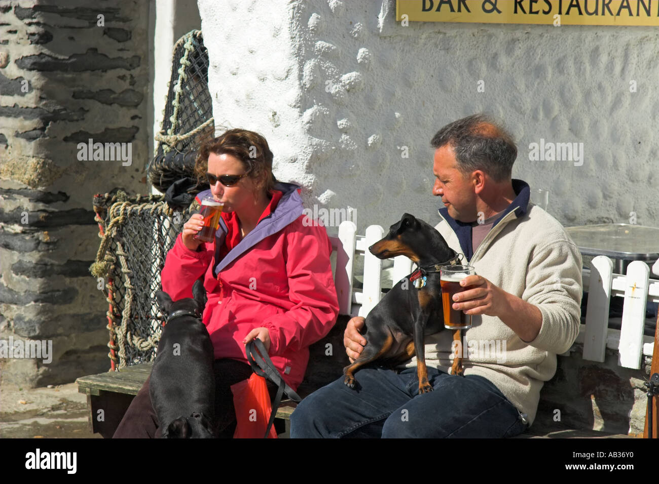 Drinking beer outside the Golden Lion pub Port Isaac Cornwall England ...