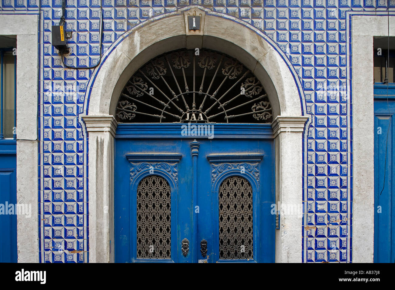 Traditional azulejos blue tiles surrounding doorway Alfama Old Lisbon ...