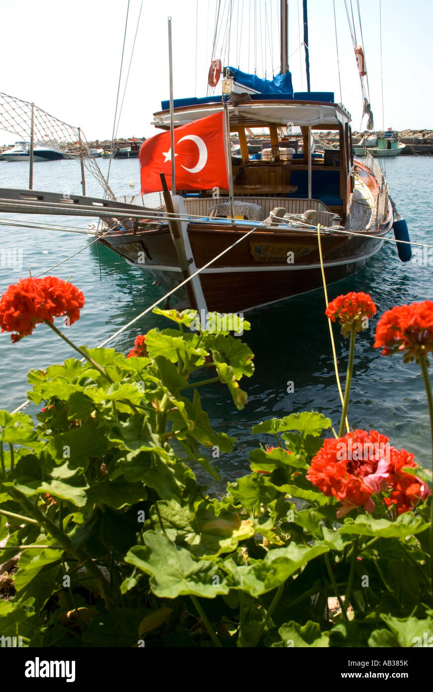 Sailboat with Turkish flag in Assos harbor at Behramkale, Turkey Stock ...