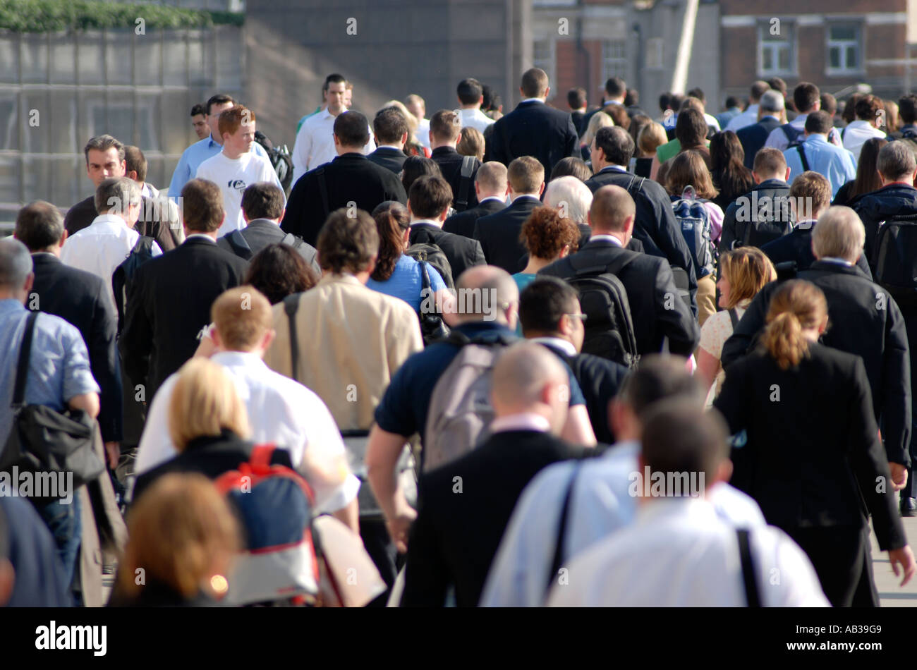 Commuters on London Bridge in the evening rush hour City of London ...