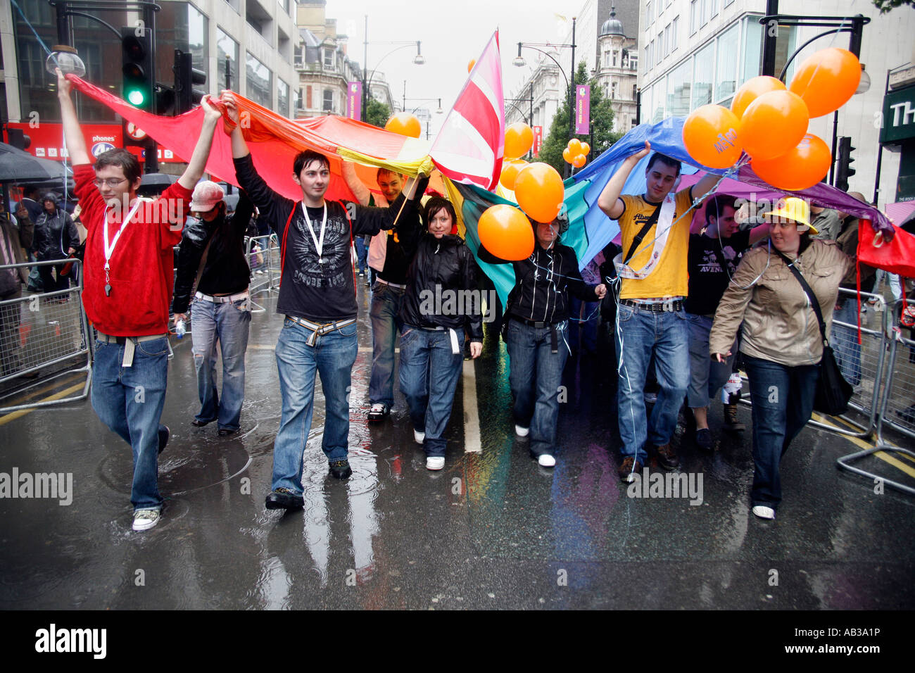 Carrying the Rainbow Flag 2007 London Gay Pride March Stock Photo - Alamy