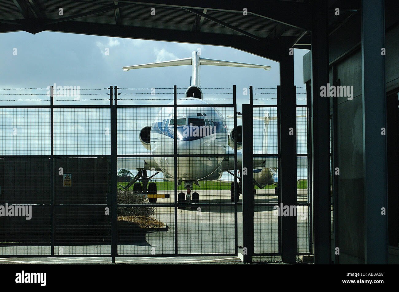 Airplane through arch Stock Photo - Alamy
