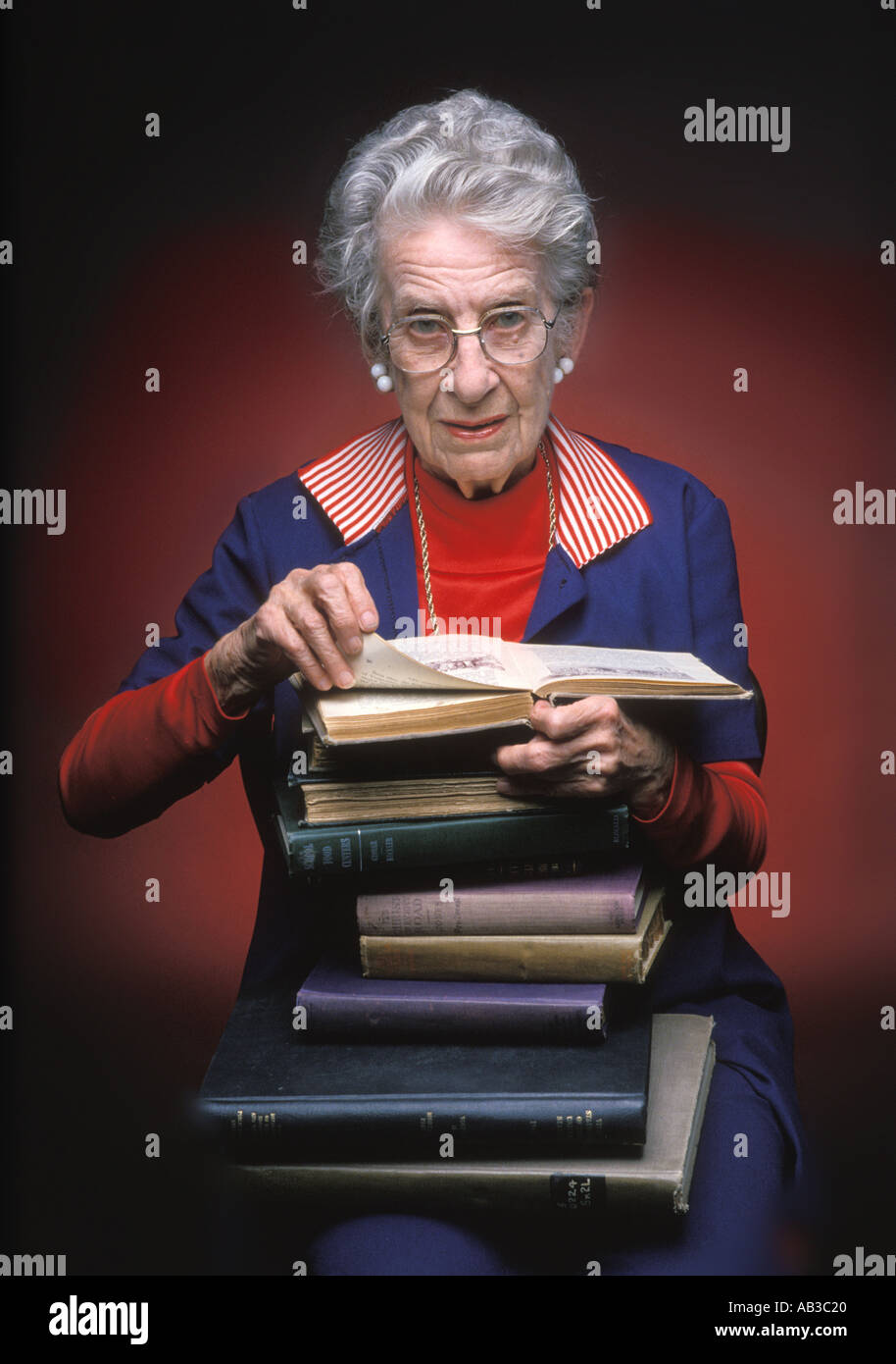 Portrait of elderly female librarian Stock Photo - Alamy