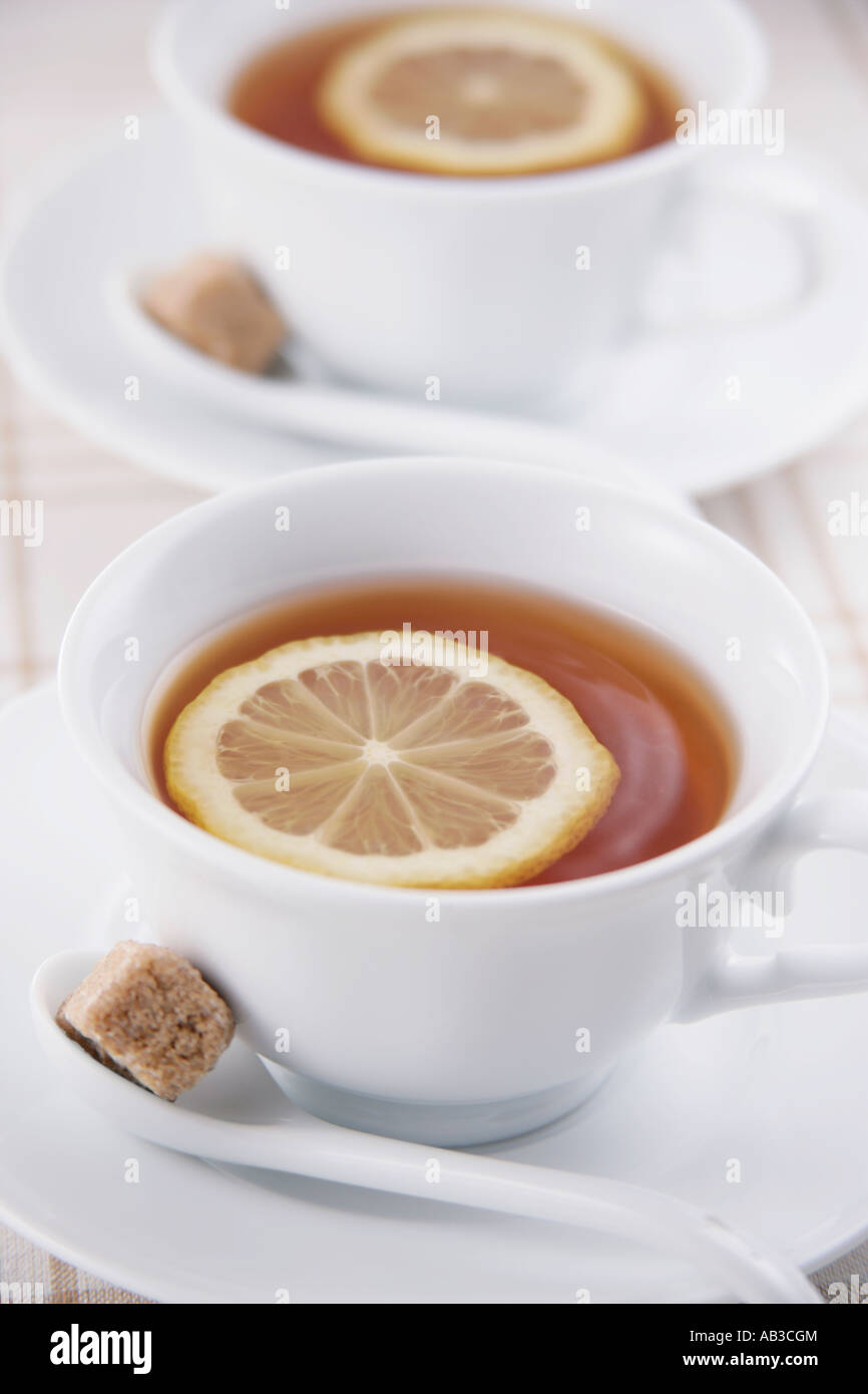 Two cups of tea with lemon Stock Photo - Alamy