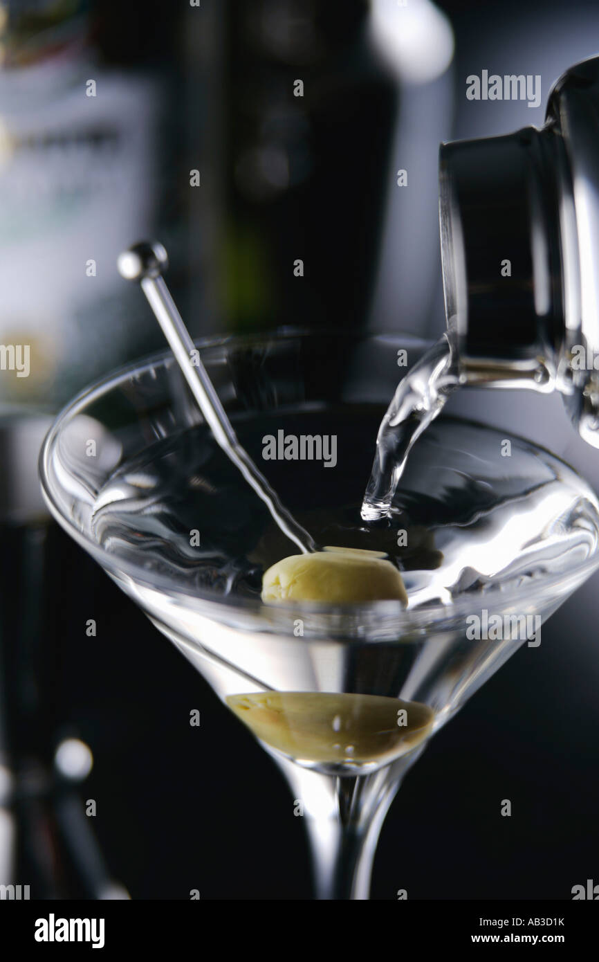 Cocktail pouring into glass Stock Photo - Alamy