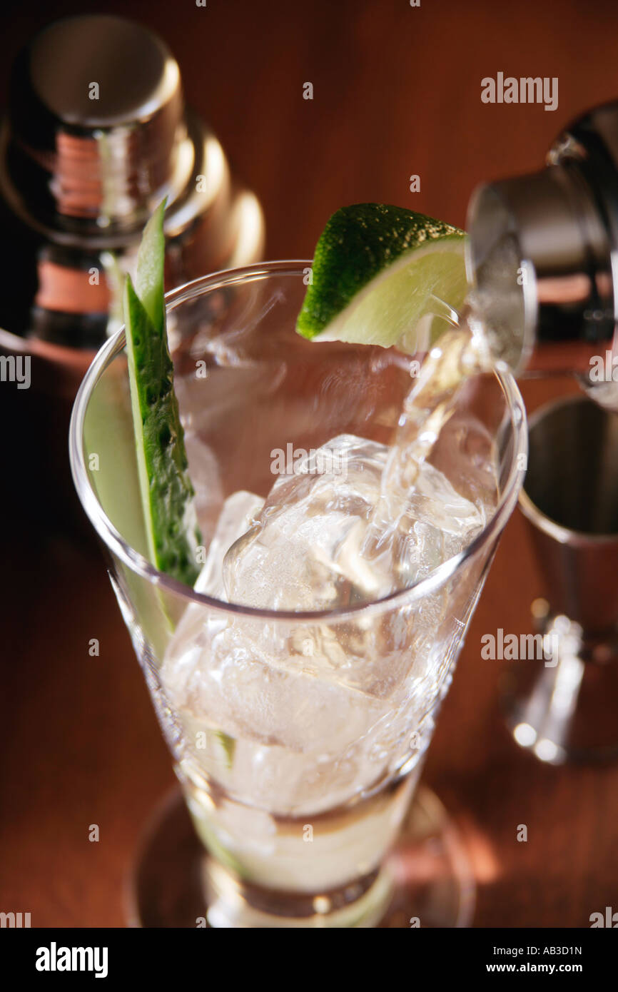 Cocktail pouring into glass Stock Photo - Alamy