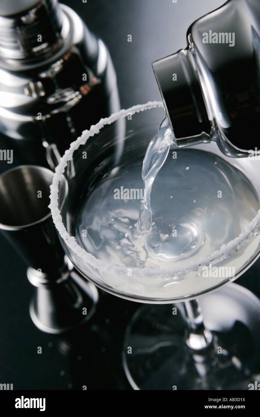 Cocktail pouring into glass Stock Photo - Alamy