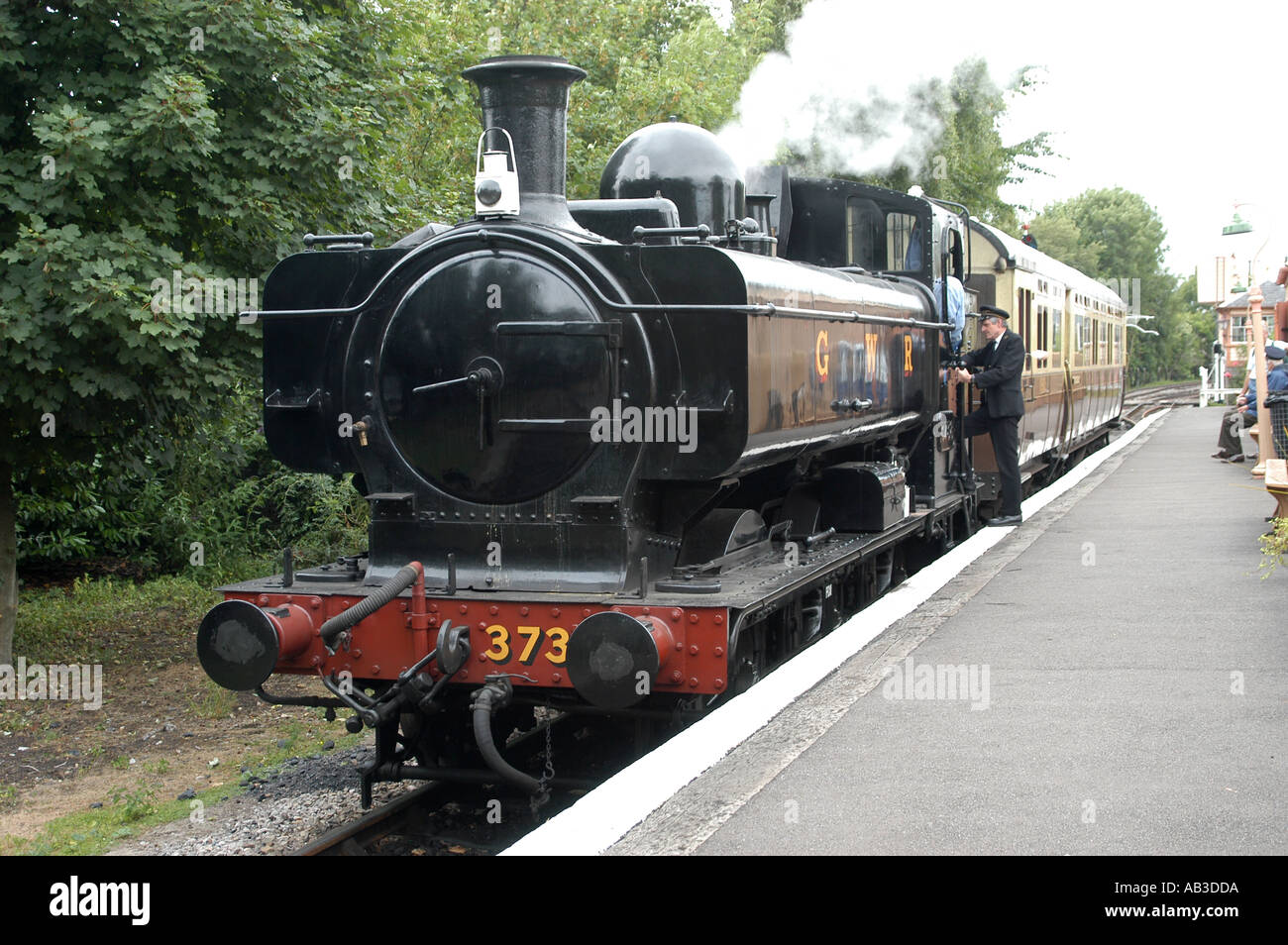 Steam locomotive at station Stock Photo - Alamy