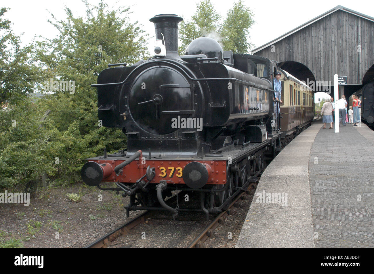 Steam engine and carriages at station Stock Photo - Alamy