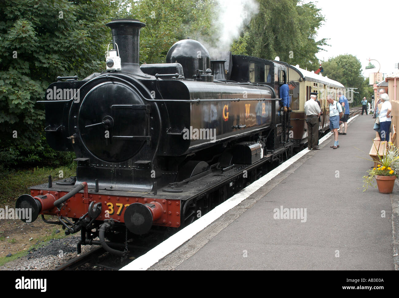 Steam train standing at the station Stock Photo - Alamy