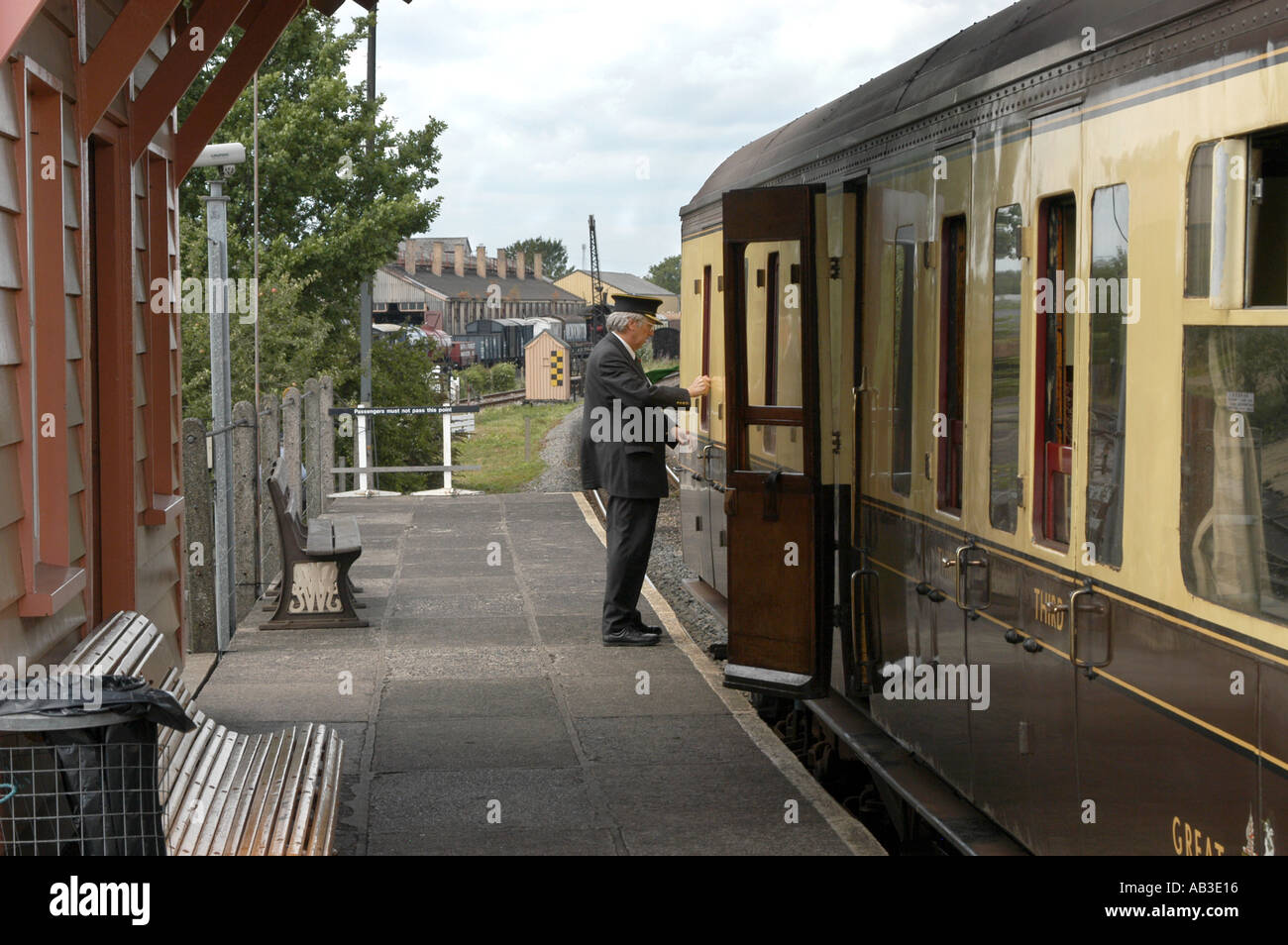 Guard on the platform attends to the train in the station Stock Photo ...