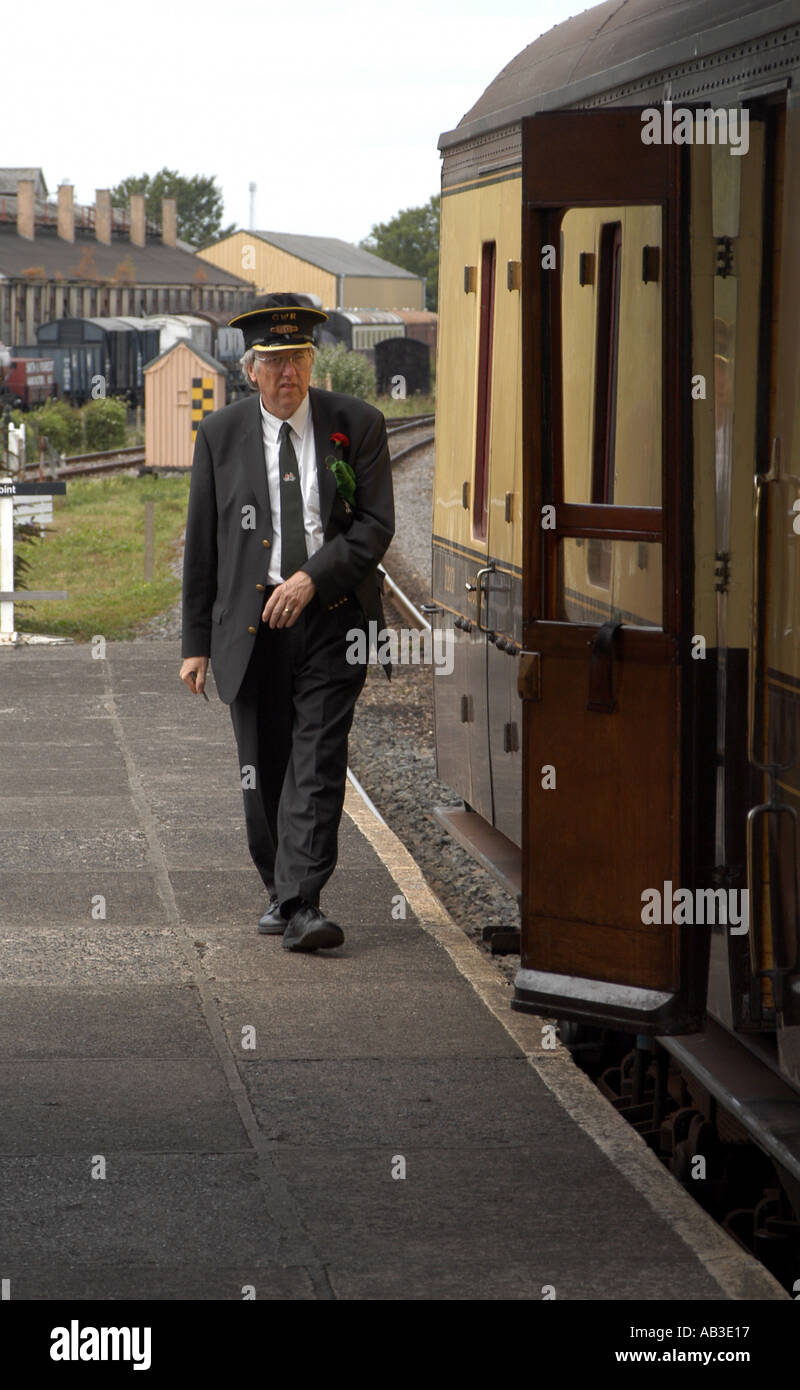 Guard on the platform attends to the train in the station Stock Photo ...