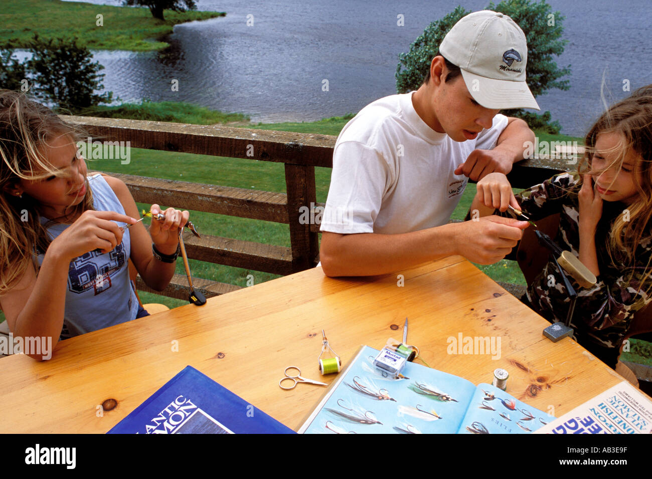 Girls fly tying hi-res stock photography and images - Alamy