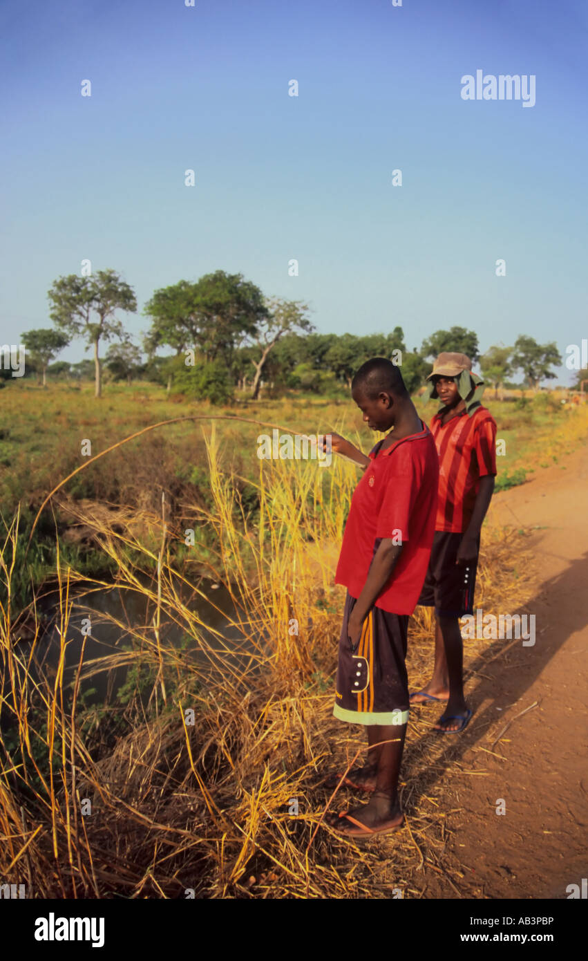 Boys fishing in rural southern Chad near Kome and Doba Stock Photo - Alamy