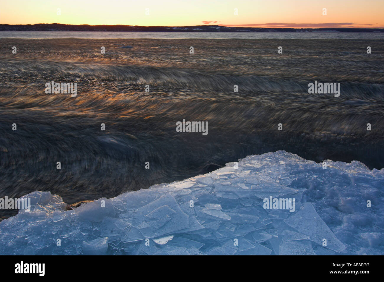 Sunset at icy lake Stock Photo - Alamy